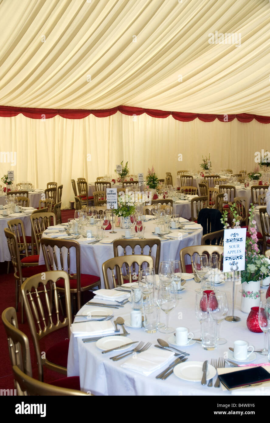 Tables setup in marquee ready for wedding reception meal Stock Photo ...