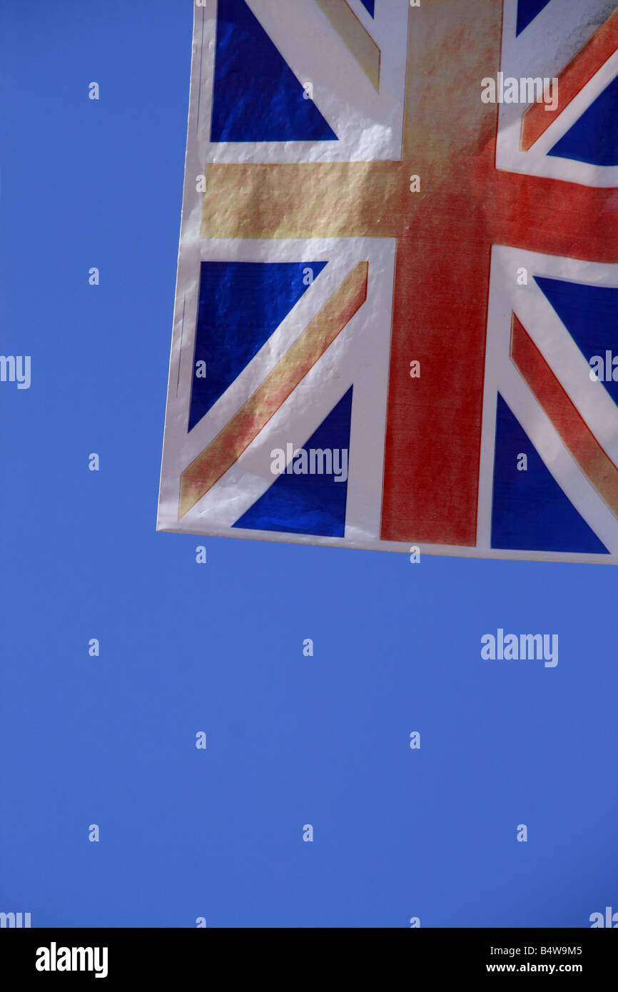 old faded union jack flag flying in wind in sun Stock Photo - Alamy