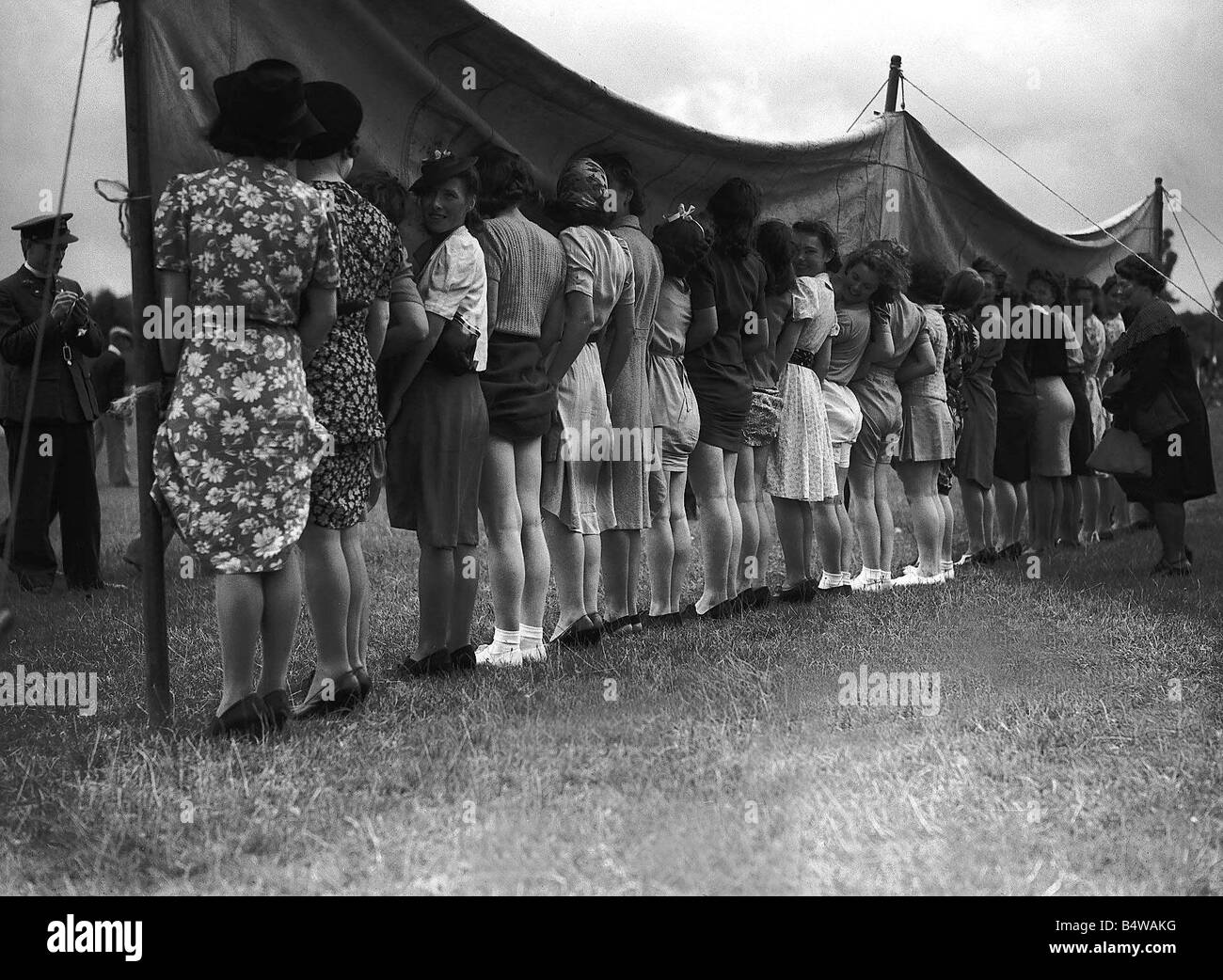 Covering her legs Black and White Stock Photos & Images - Alamy