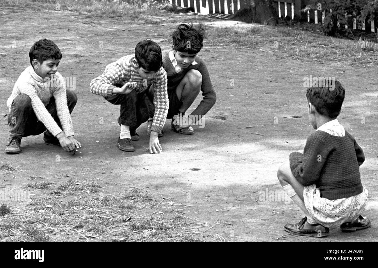 Children playing marbles Black and White Stock Photos & Images - Alamy