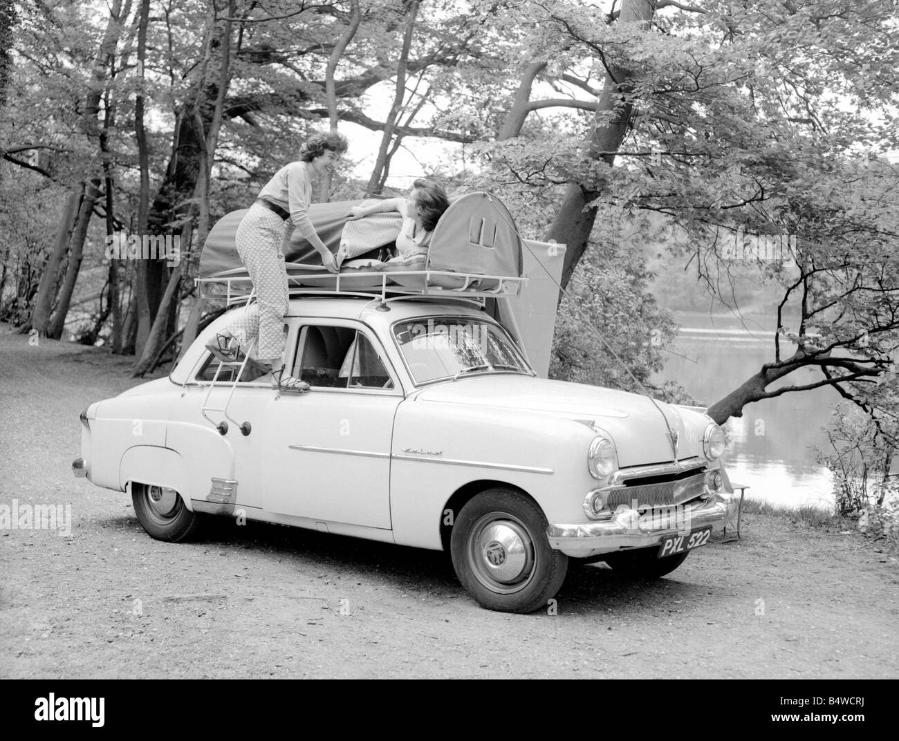 Two reveille models seen here demonstrating the new car rack tent ...