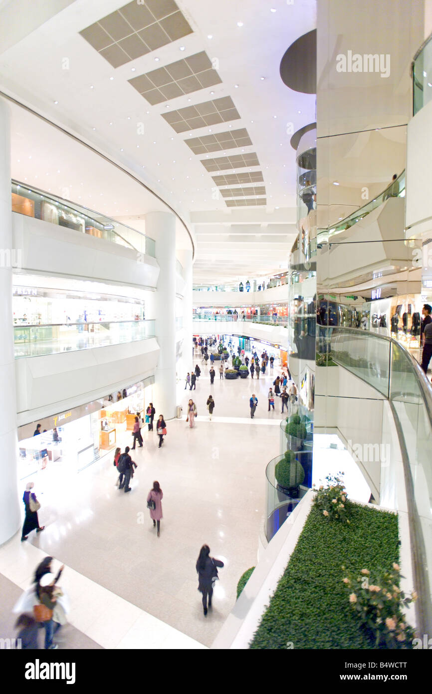 Gleaming white interior of the Pacific Place shopping mall in the ...