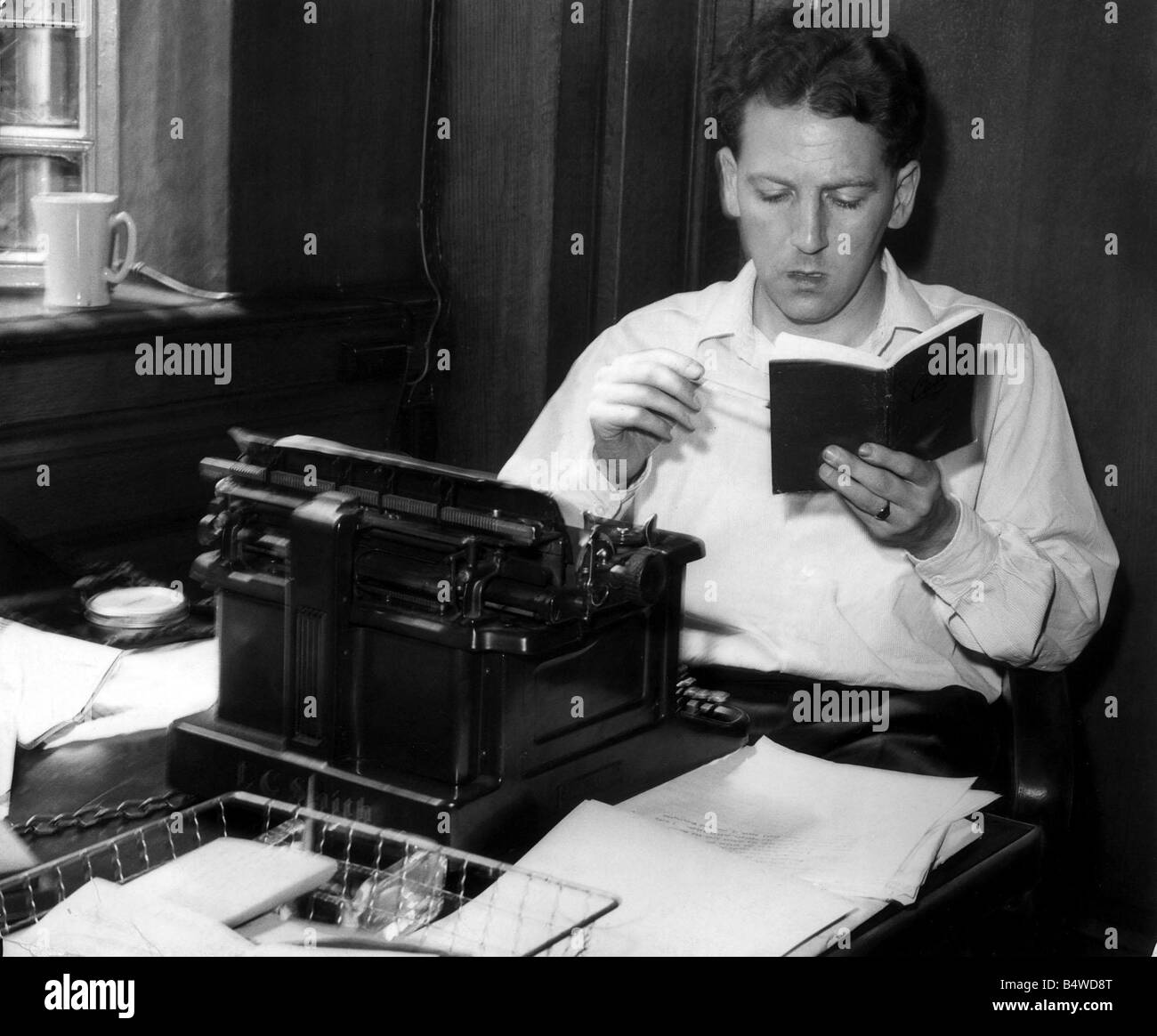 Keith Waterhouse Daily Mirror columnist July 1957 Sitting at typewriter ...