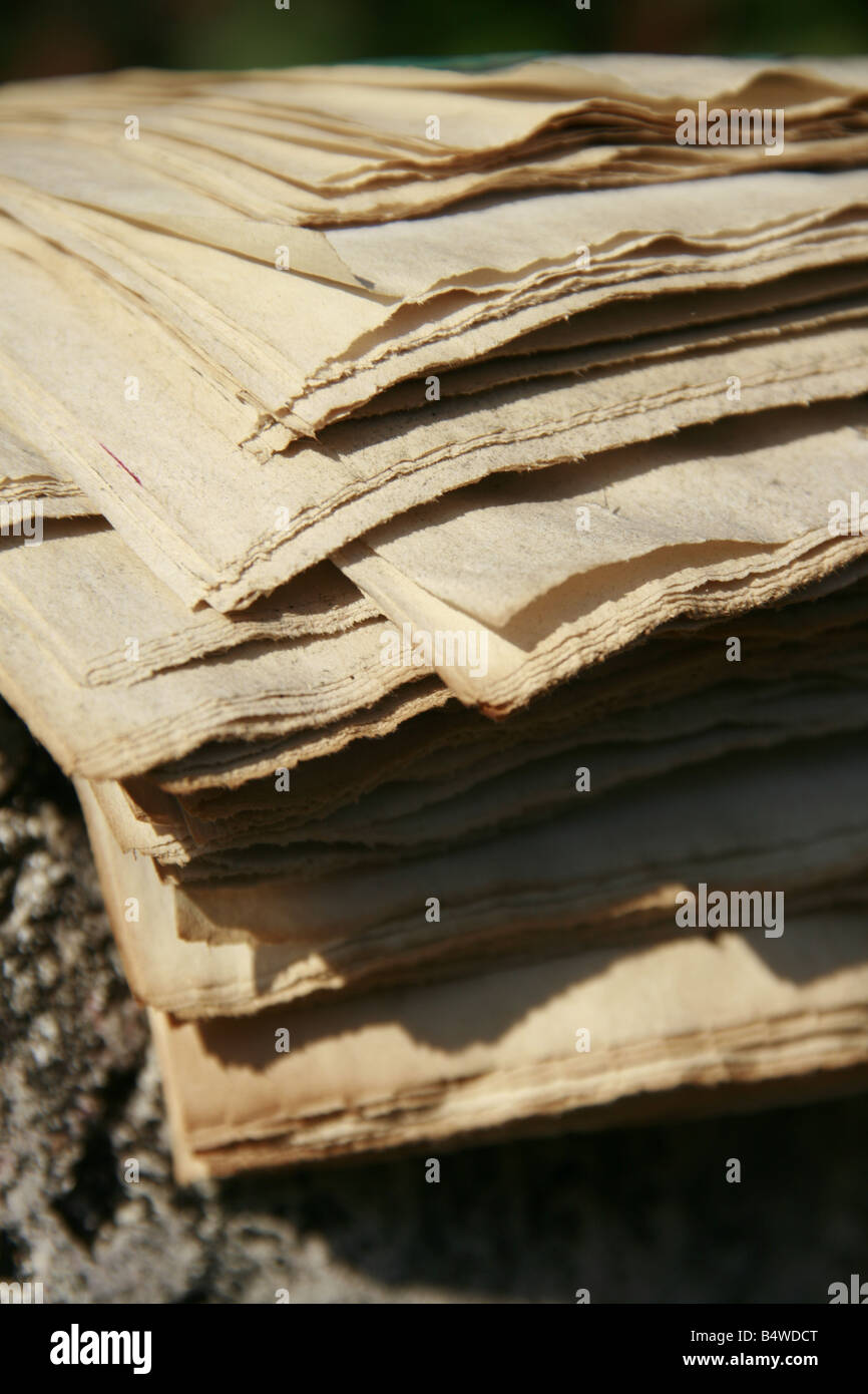 pile of old faded newspapers outdoors in sun Stock Photo - Alamy