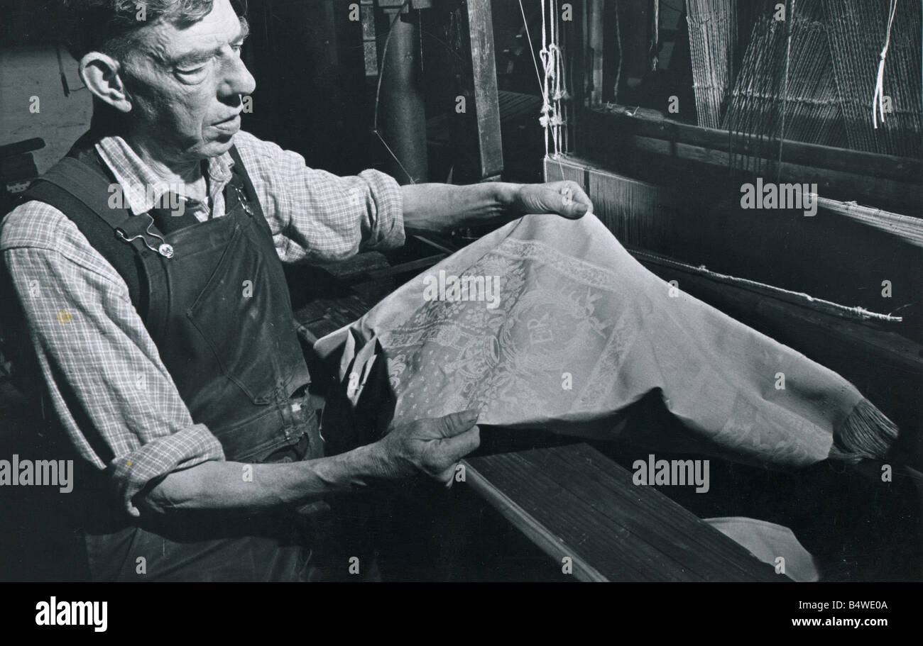 Textile Industry Ireland worker holds up some material Weaving Cloth ...