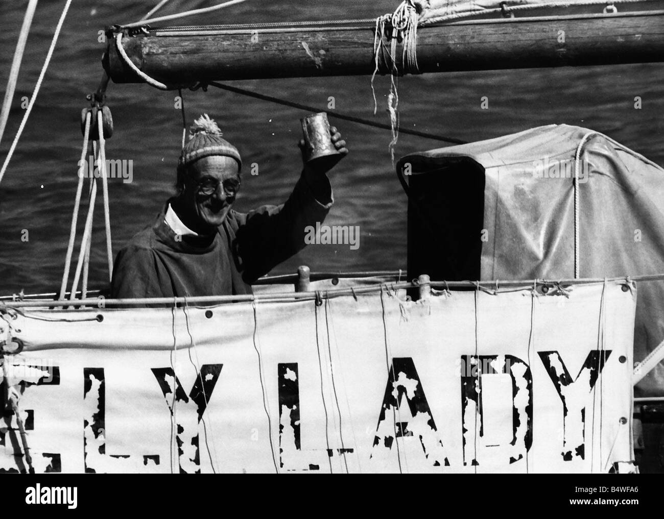 Round the world sailor Alec Rose raises a mug on board his yacht Lively ...