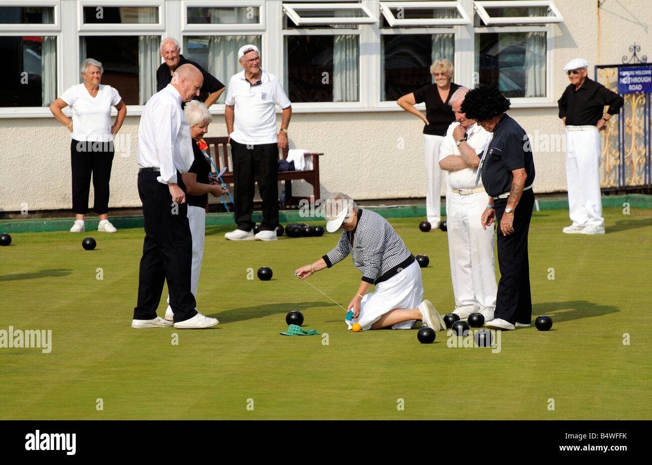 Bowls match measuring distance of jack on the green seen during a fun ...
