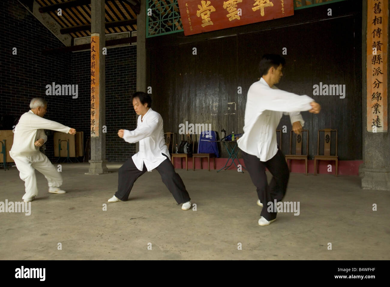 Three Men practising the martial art of Taijiquan Yang style with the ...