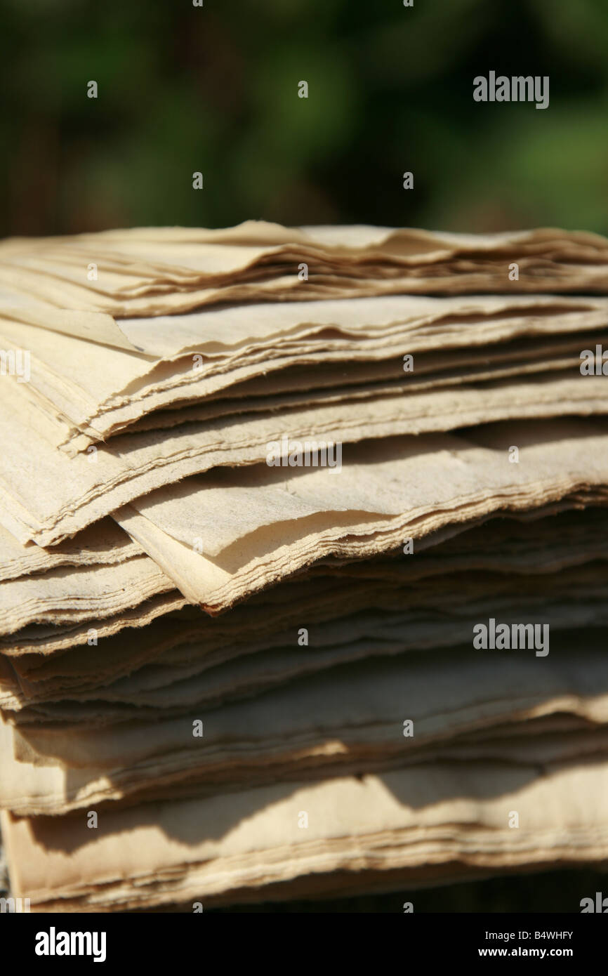 pile of old faded newspapers outdoors in sun Stock Photo - Alamy