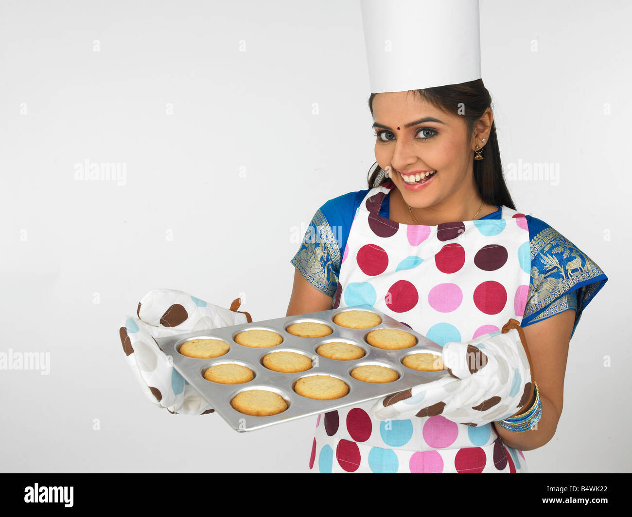 a pretty asian female baker with cookies Stock Photo - Alamy