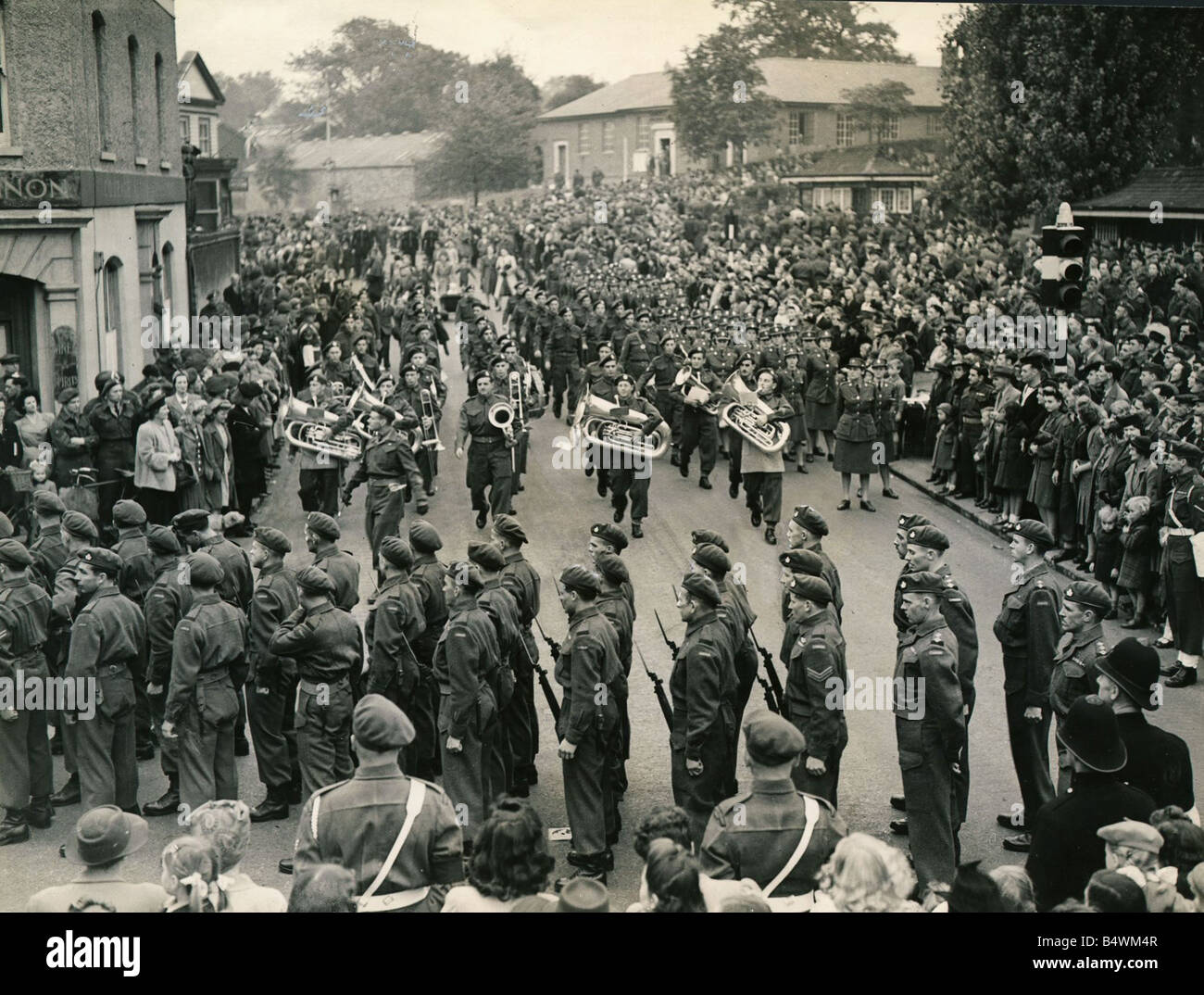 Canadian Army including the band and WAACs marching through Aldershot ...