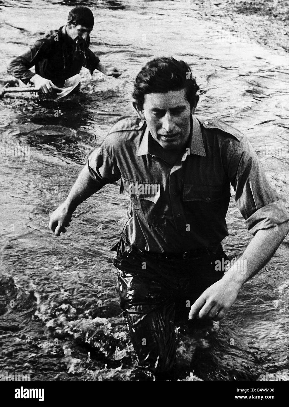 Prince Charles Wades Along A Stream January 1975 Stock Photo - Alamy