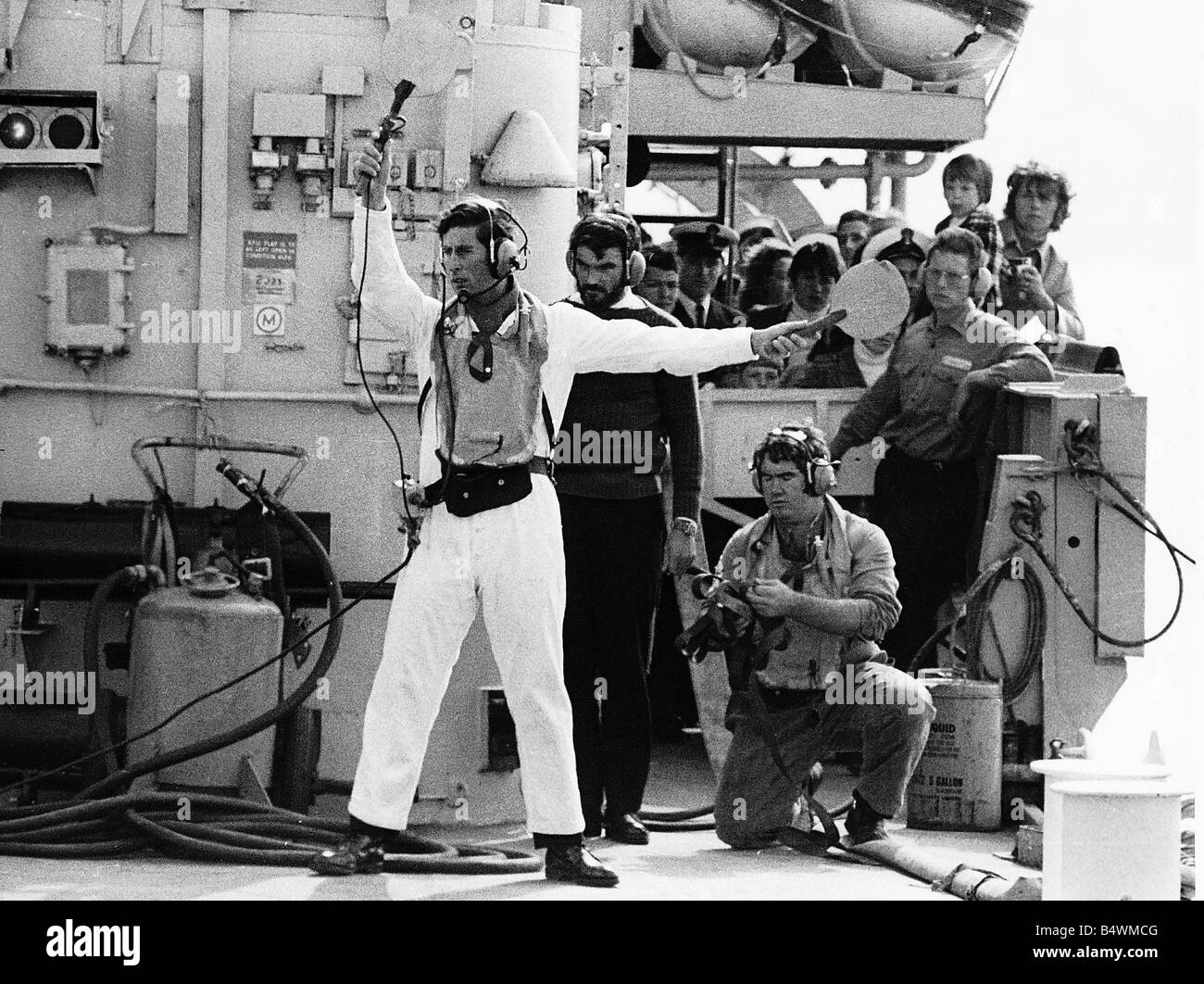 Prince Charles acting as batman to guide the helicopter of HMS Jupiter ...