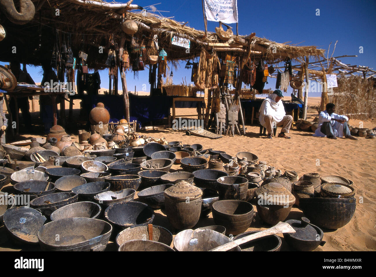 Traditional implements and trinkets for sale at a stall in the Sahara ...