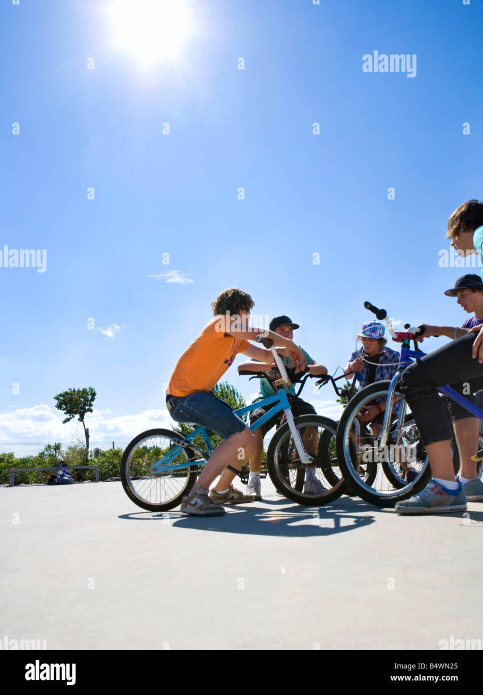 Group of teenagers on bikes Stock Photo - Alamy