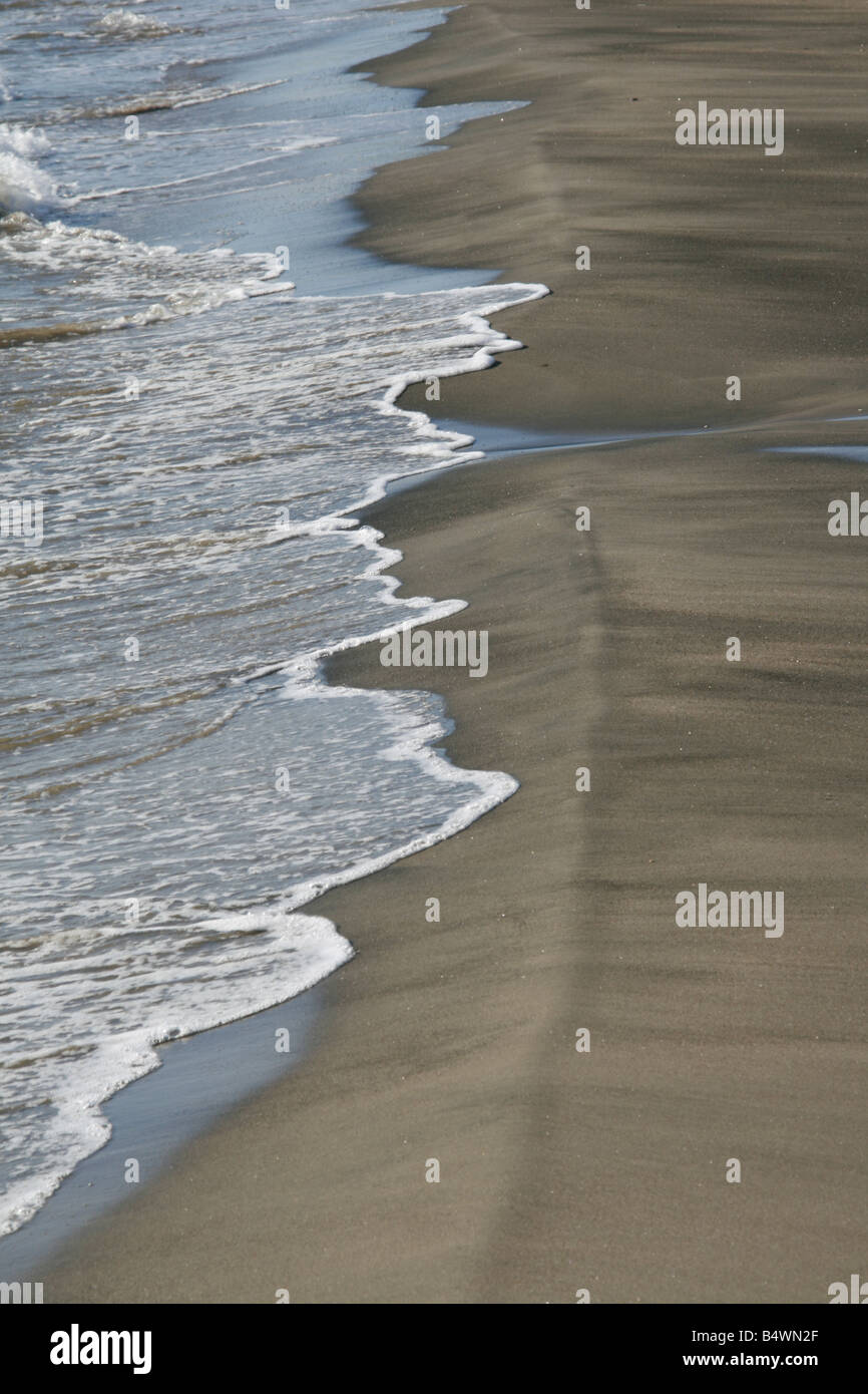 sea wave on sand on beach coast shore Stock Photo - Alamy