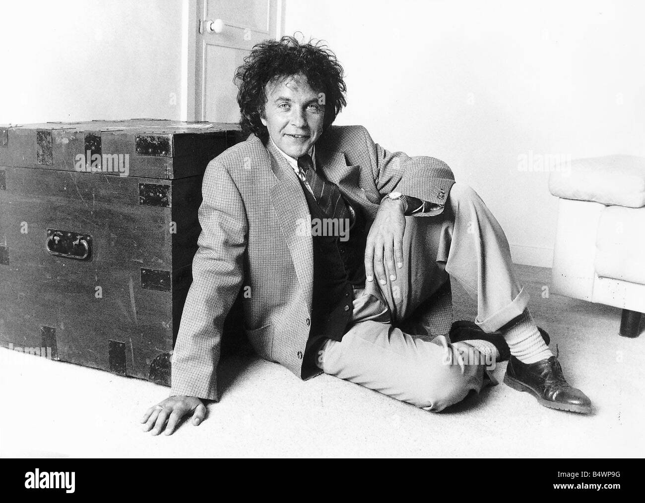 David Essex Singer leaning against a blanket chest Stock Photo - Alamy