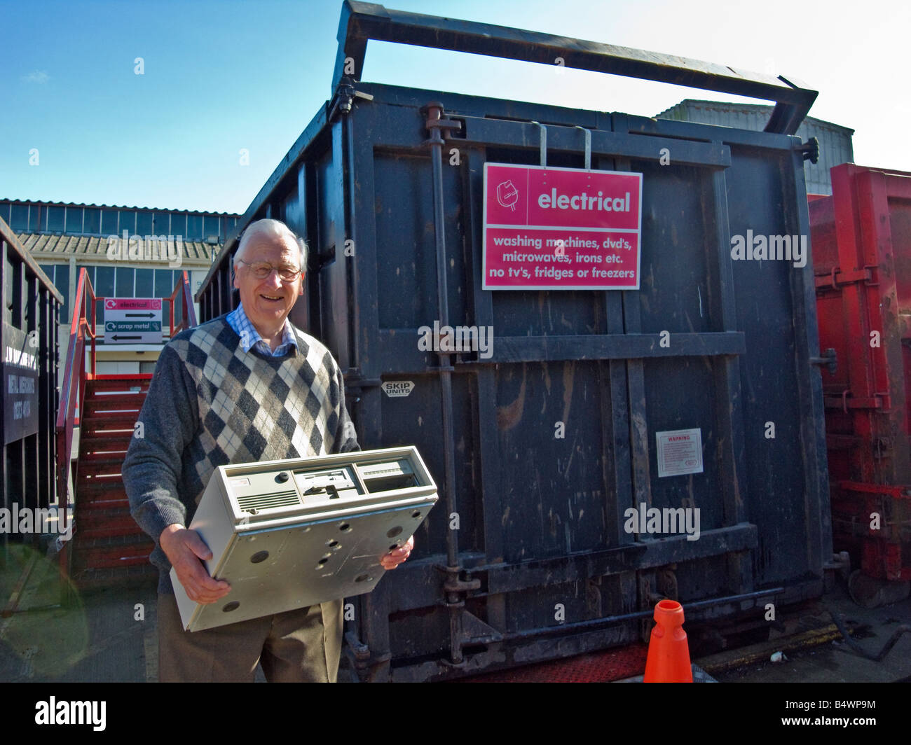 Pensioner disposing of old desktop computer at local recycling pointr ...