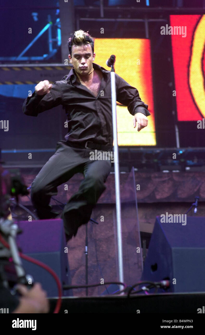 Robbie Williams stadium tour in Ireland July 2001 Jumping on stage ...