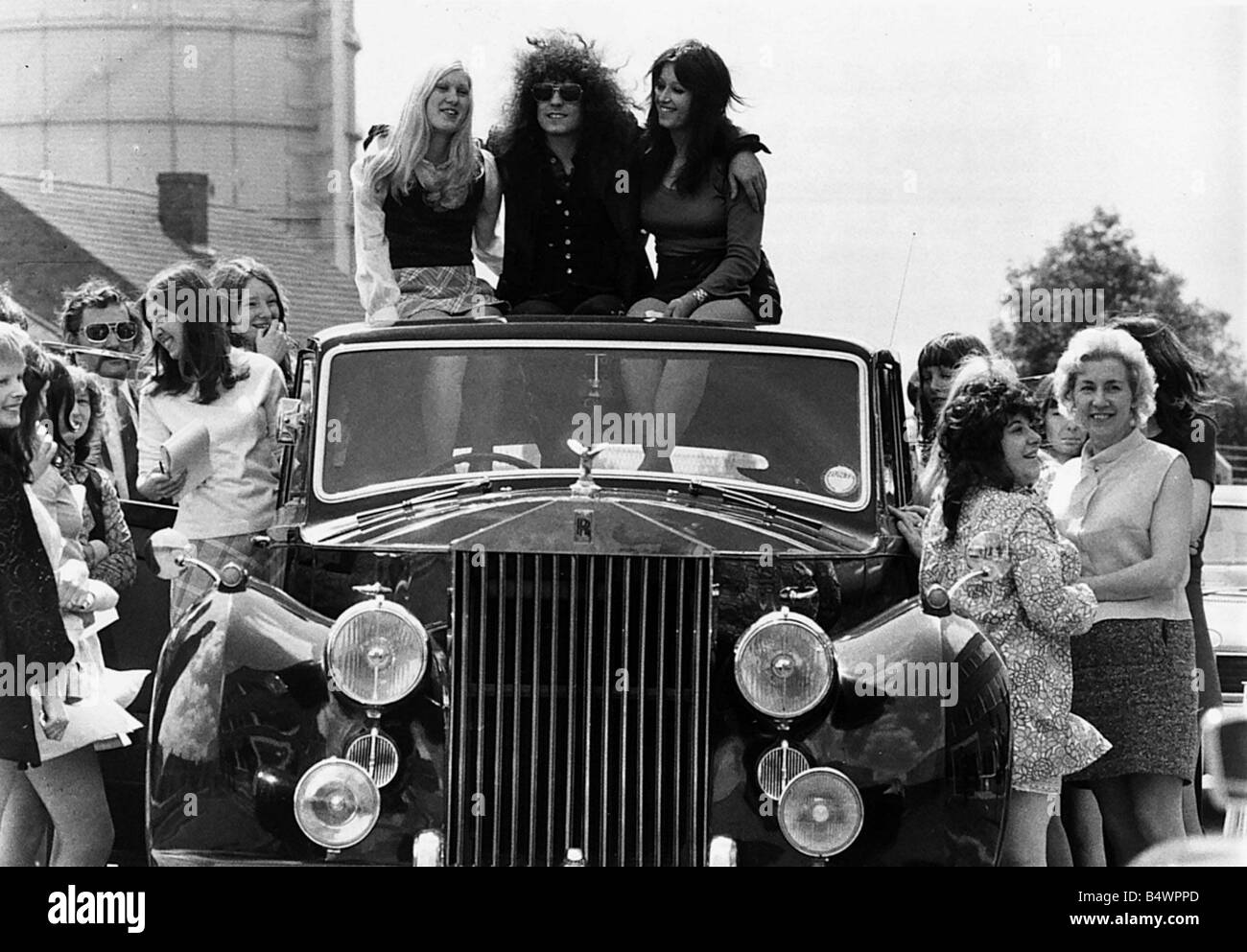 Marc Bolan pop singer rides roof of Rolls Royce 1972 Stock Photo - Alamy