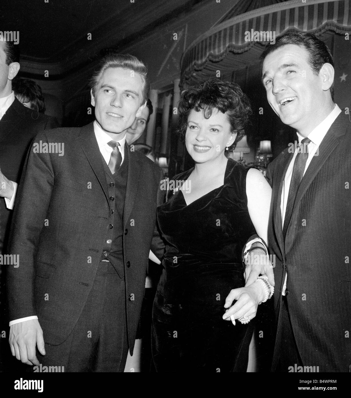 Film actress Judy Garland with pop singer Adam Faith (left) and Radio ...