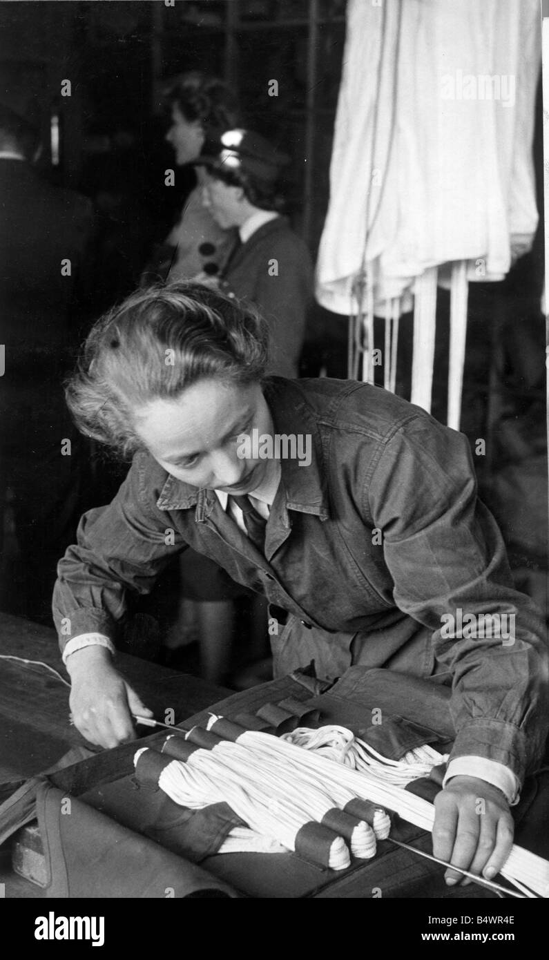 WAAF officer packing a parachute for RAF pilots to use during one of ...
