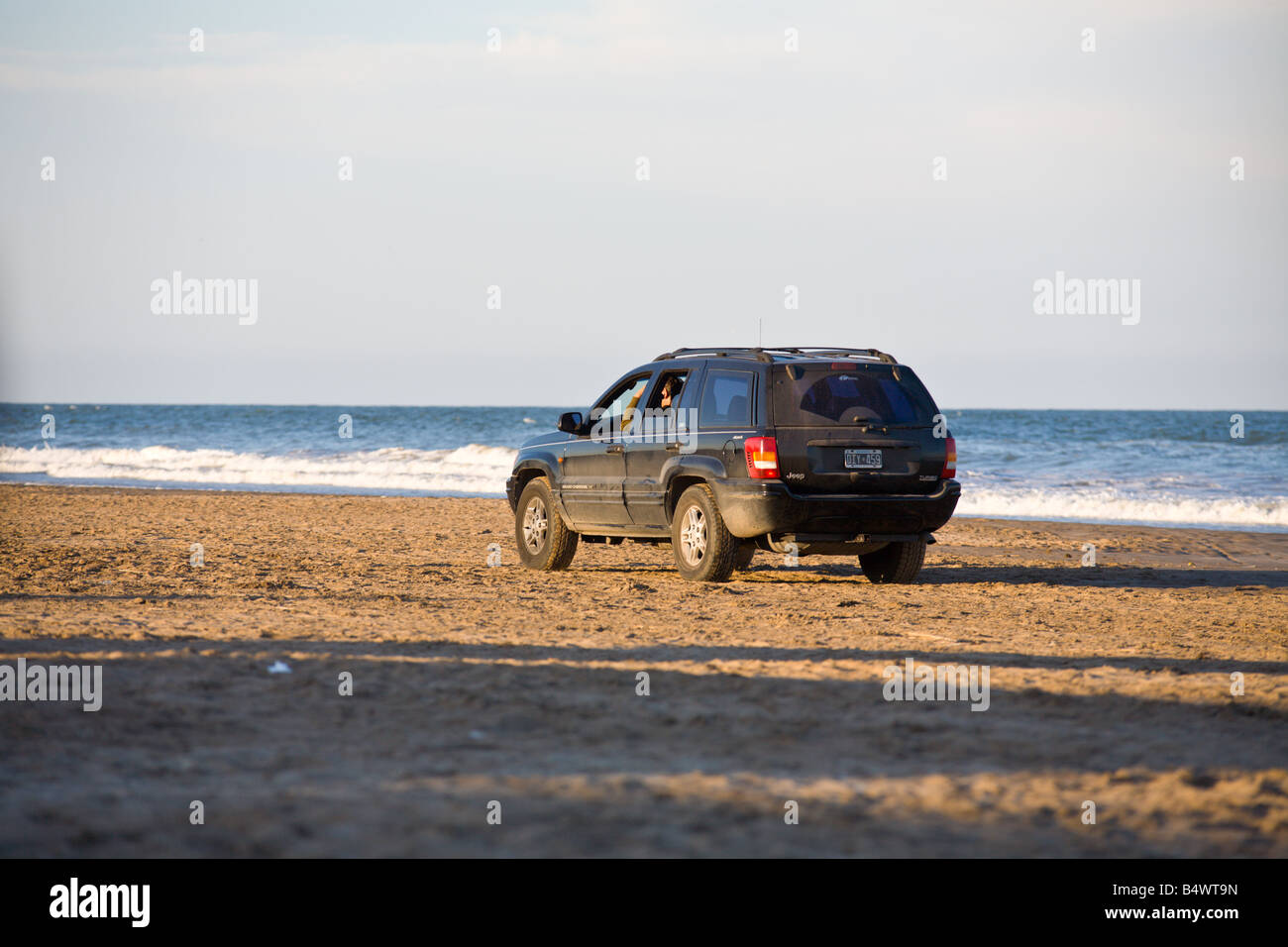 Car driving at the beach in a sunny day Stock Photo - Alamy