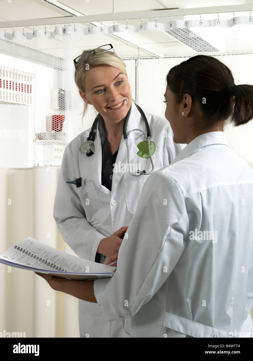 Two doctors discussing Stock Photo - Alamy