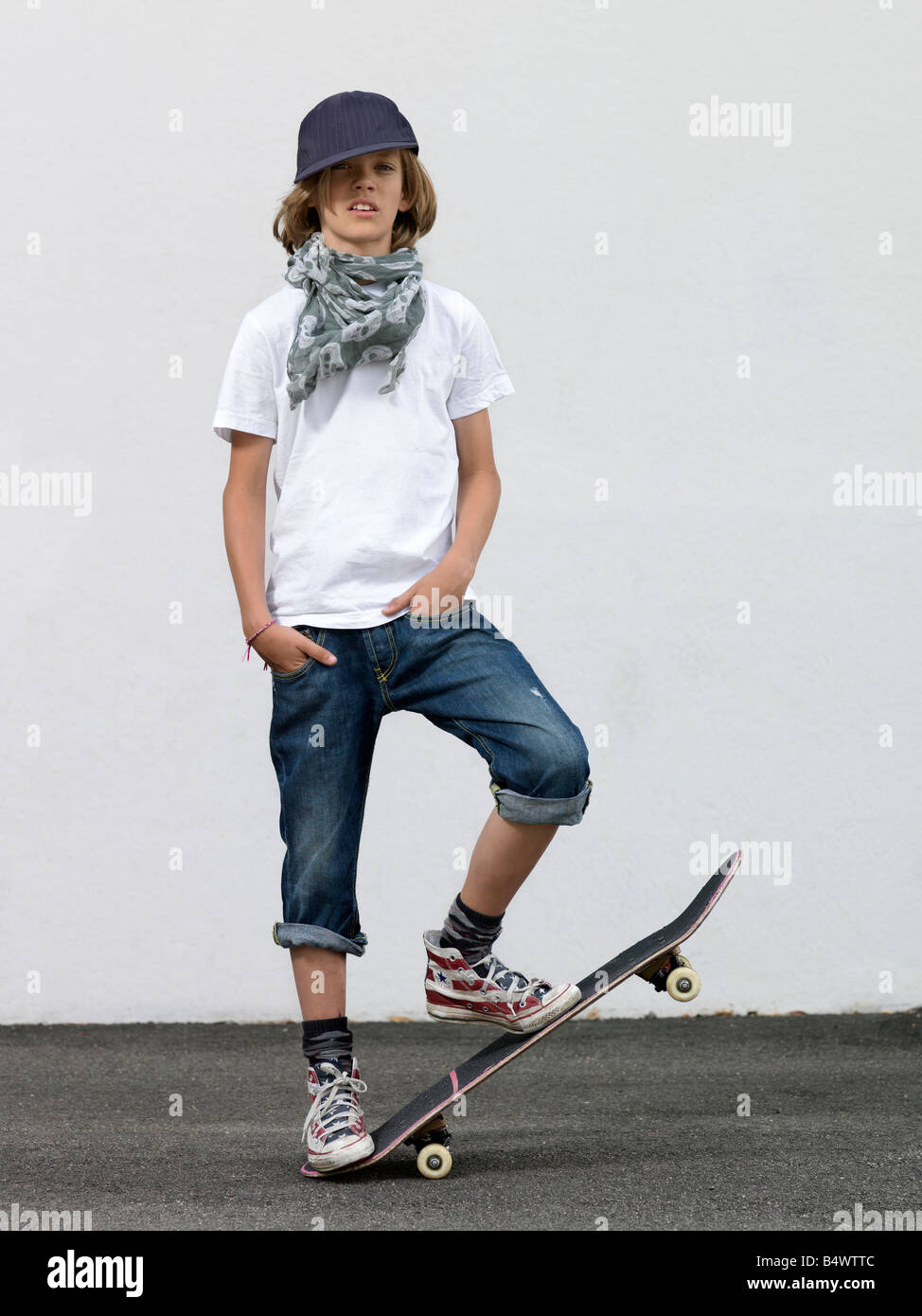 Boy with skateboard Stock Photo - Alamy