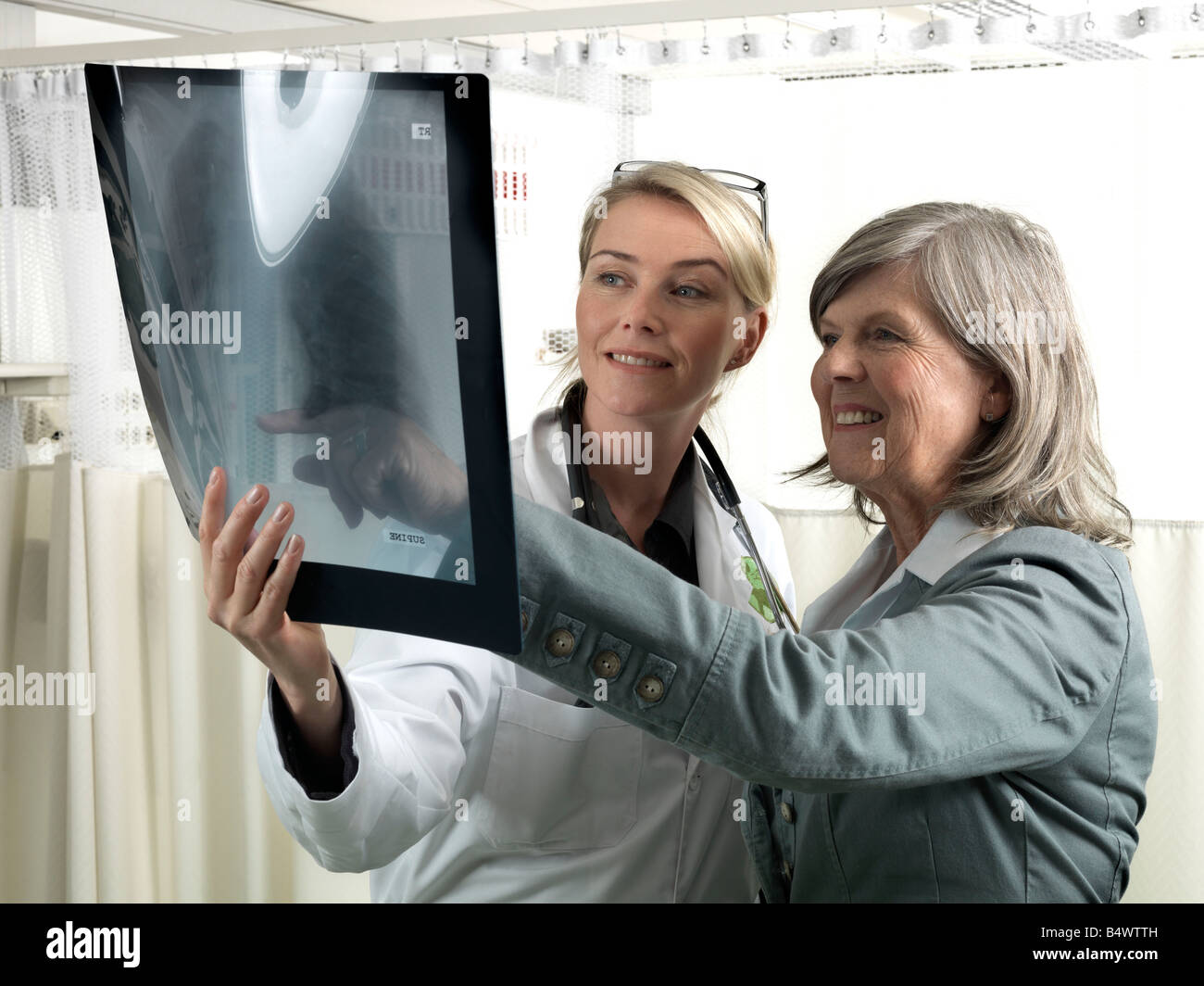 Doctor and patient with x-ray Stock Photo - Alamy