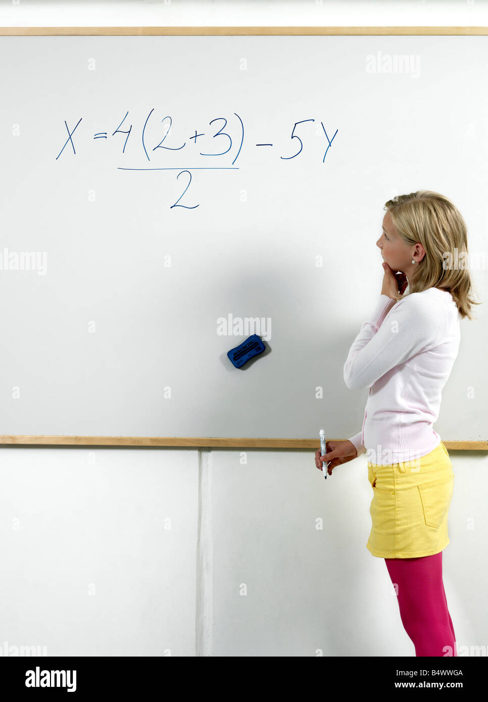 Girl standing by whiteboard Stock Photo - Alamy