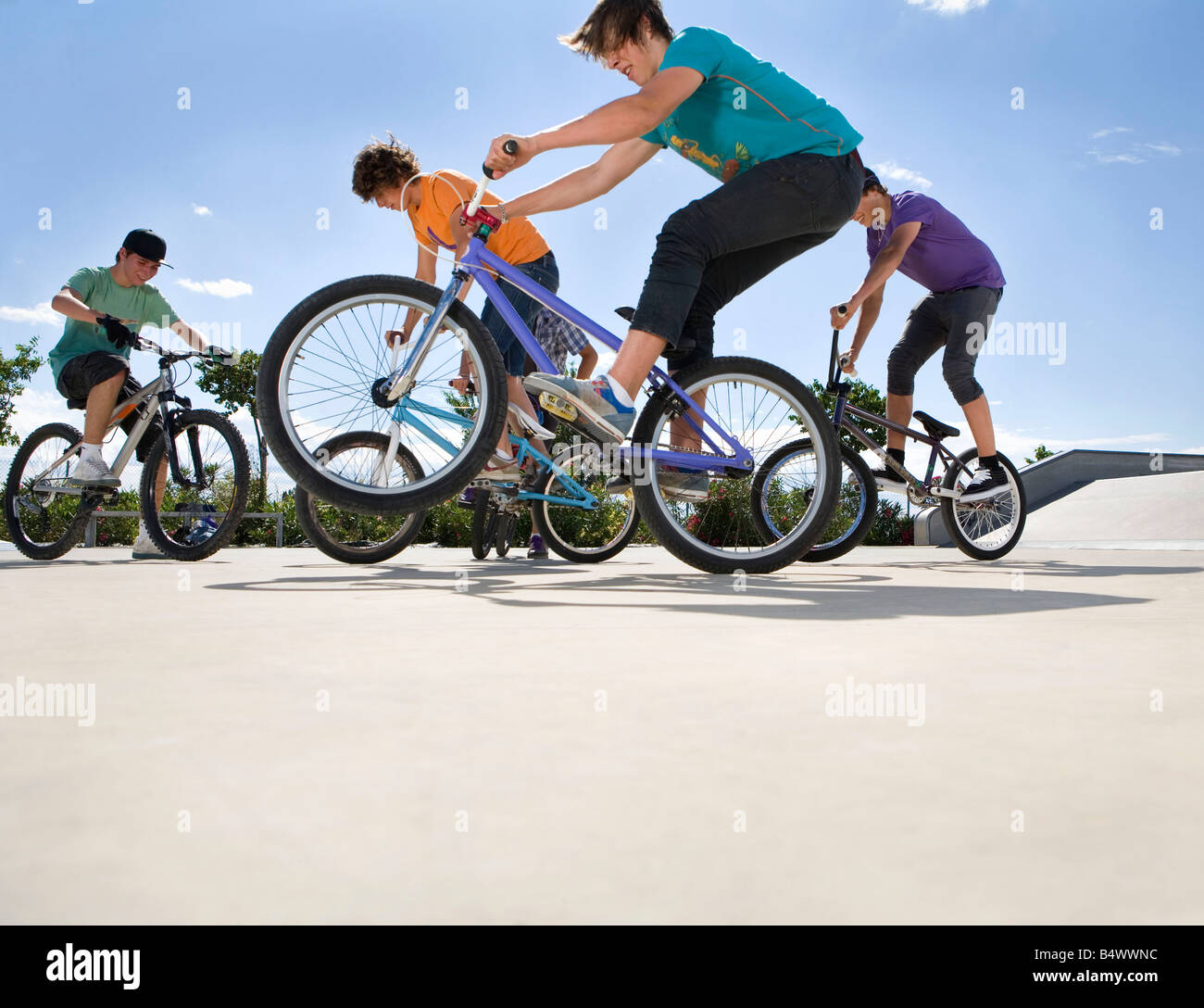 Teen boys riding bikes Stock Photo - Alamy
