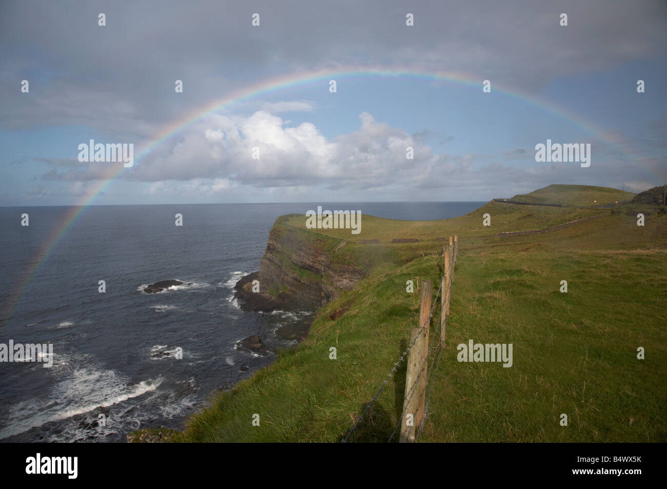 rainbow over cliffs on the north antrim causeway coastal route county ...