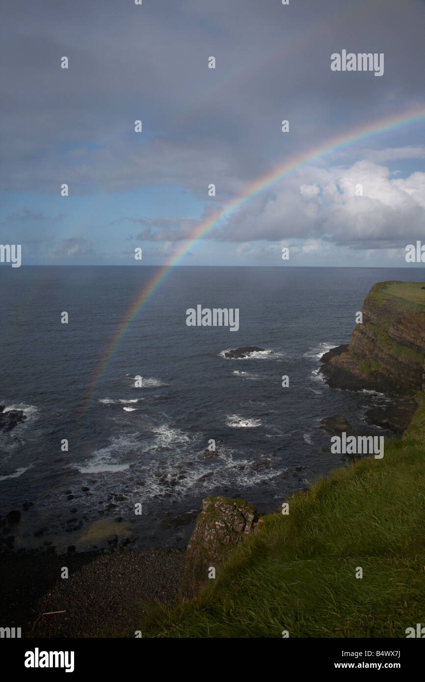 rainbow over cliffs on the north antrim causeway coastal route county ...