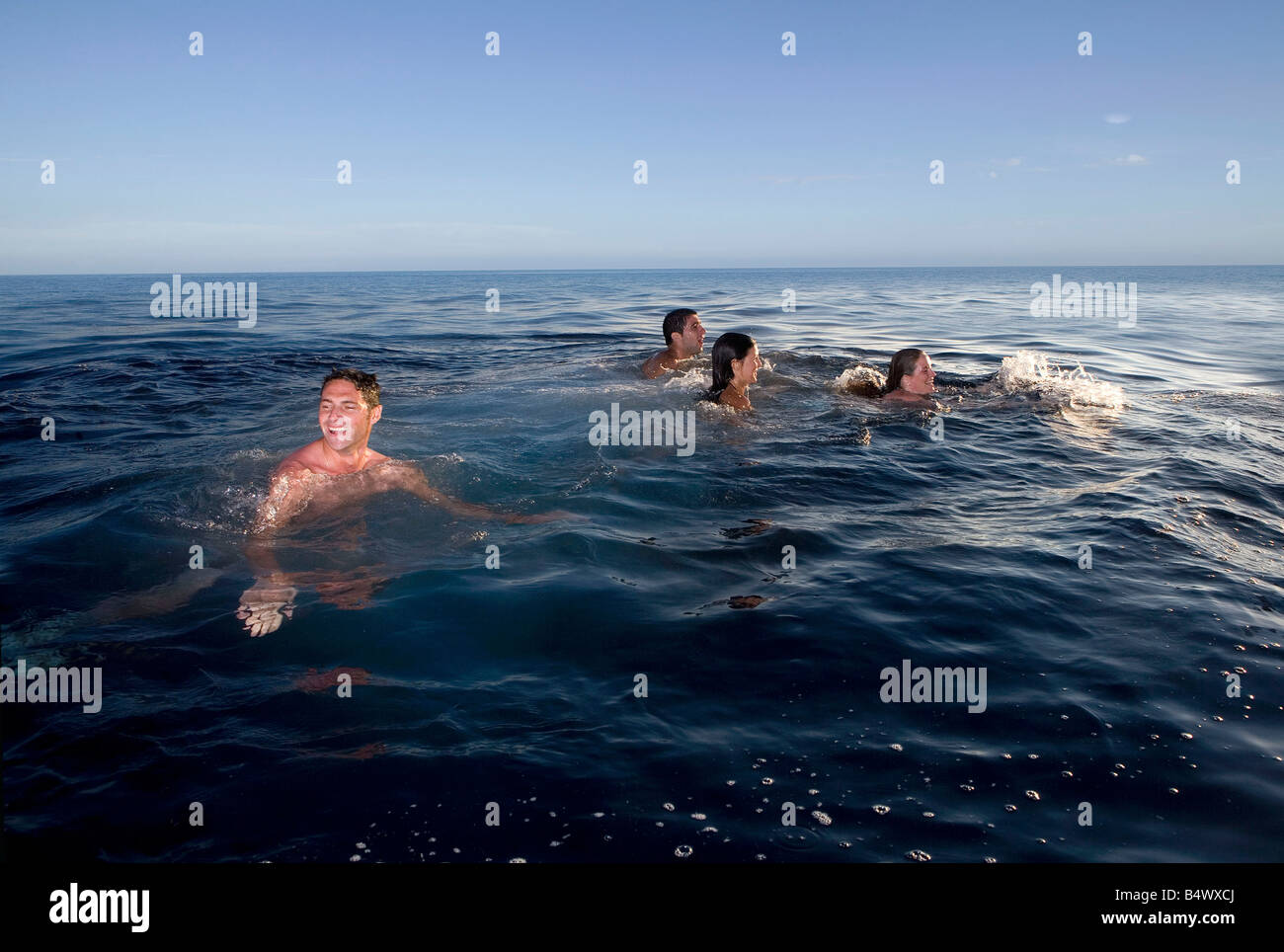 People swimming in open sea Stock Photo - Alamy