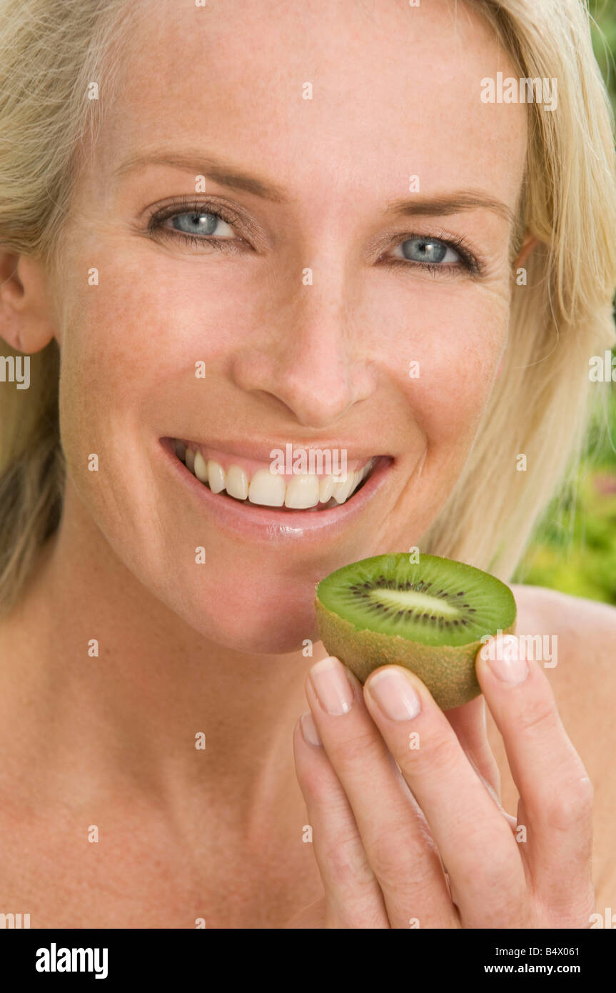 Portrait of woman healthy eating Stock Photo - Alamy