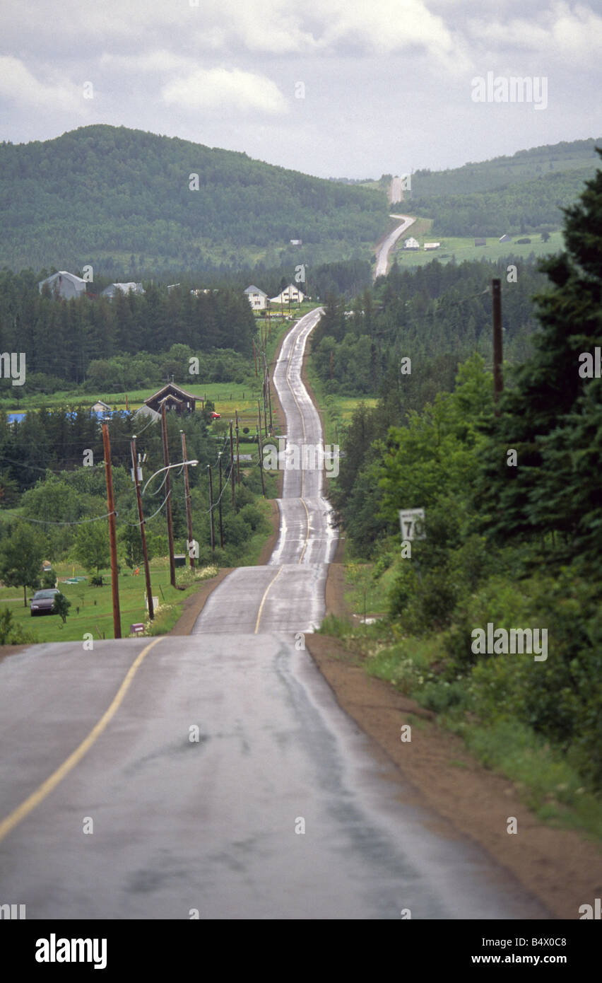 QUEBEC CITY ST LAWRENCE A narrow winding road cuts through the ...