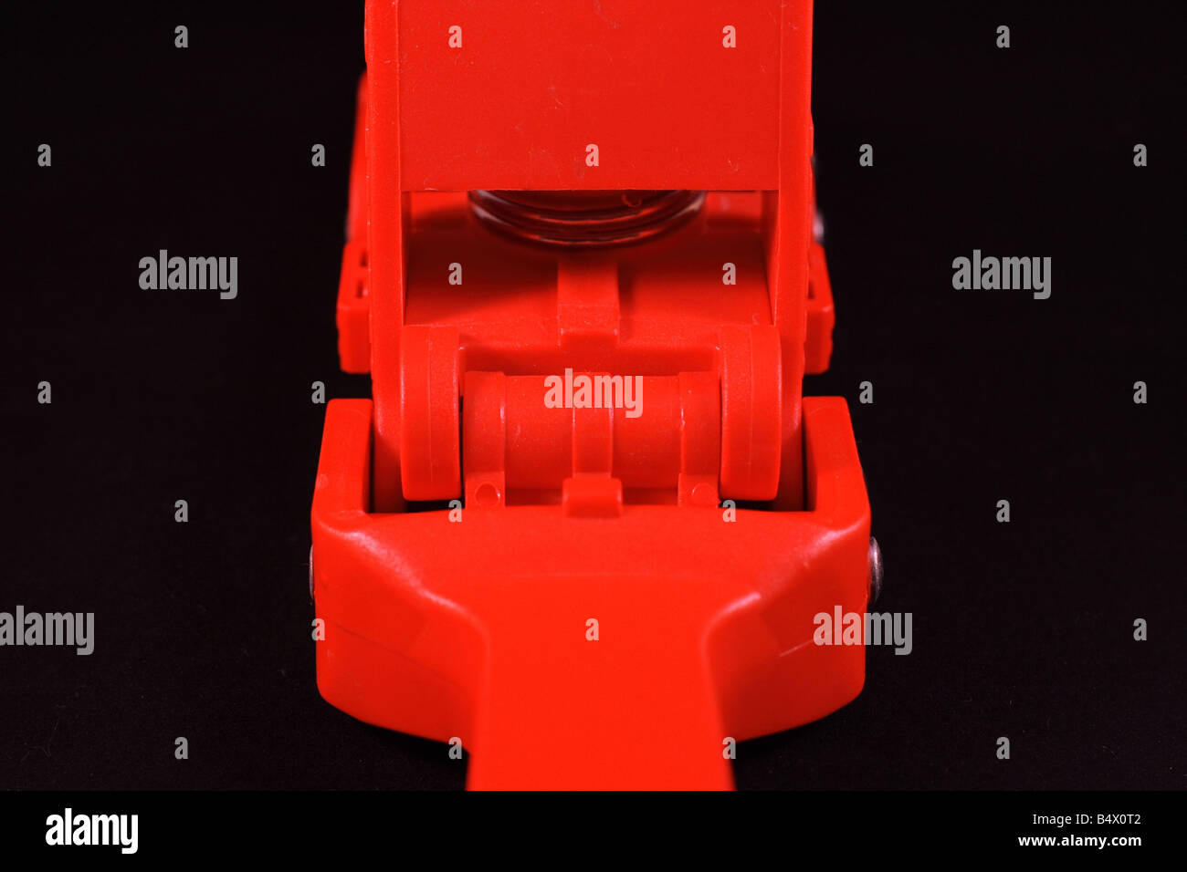 Closeup of the hinge on a hand capper for glass bottles Stock Photo - Alamy