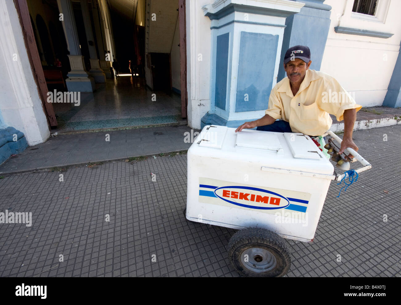 A man selling ice cream outside the Iglesia Parroquial de San Pedro ...