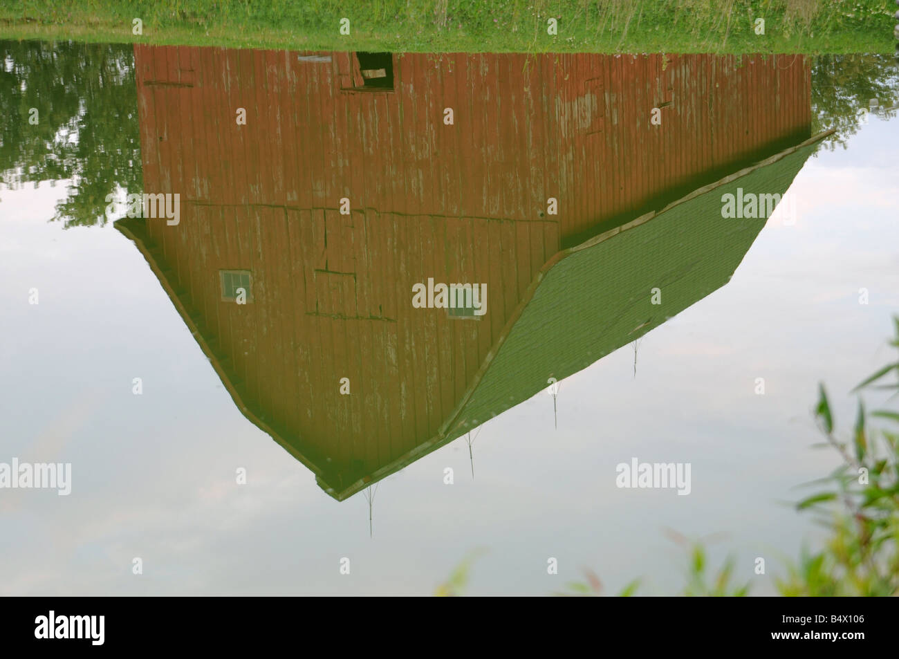 Old red barn reflecting in pond on Illinos farm Stock Photo - Alamy