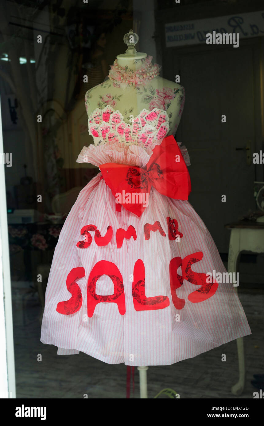 Summer sale sign inside of clothing store window Stock Photo - Alamy