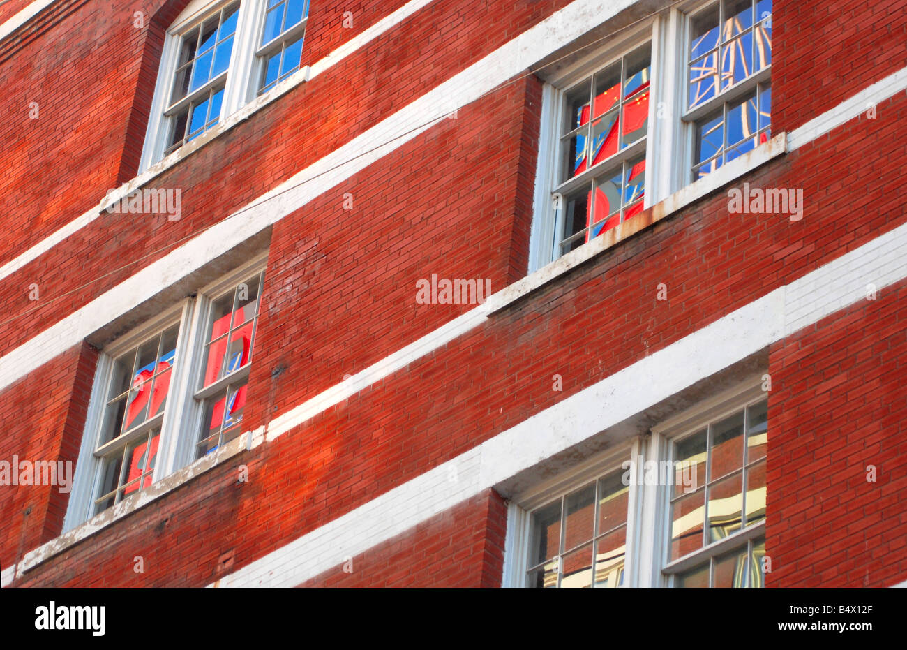 sign reflection in a row of windows Stock Photo - Alamy