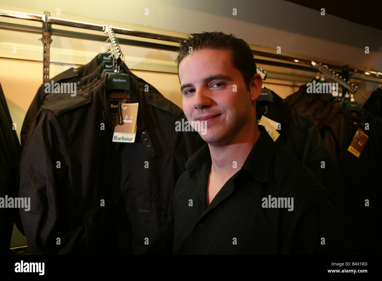 a portrait of a manager of a outdoor clothing shop Stock Photo - Alamy