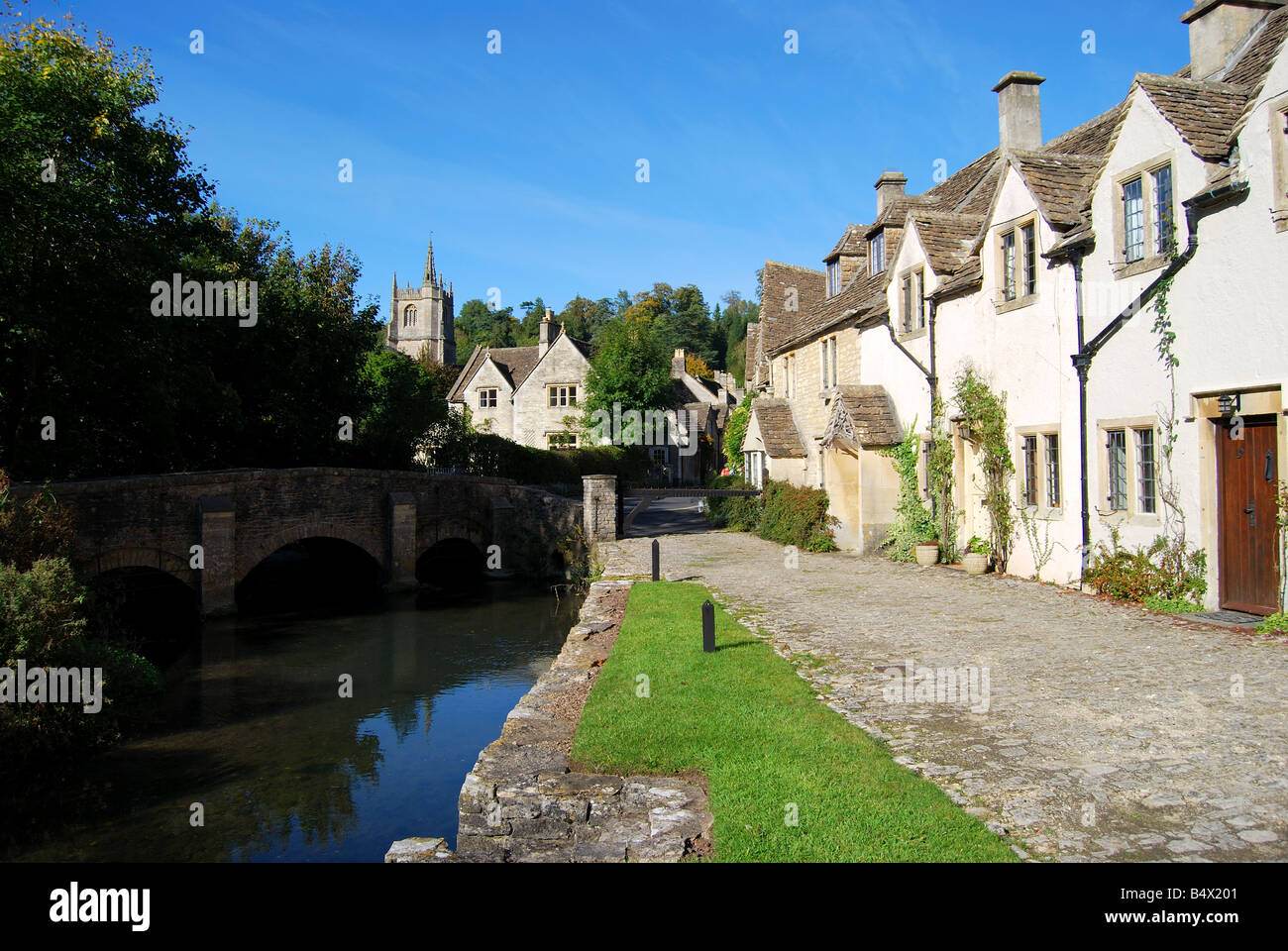 The Main street and Bybrook River, Castle Combe, Wiltshire, England ...