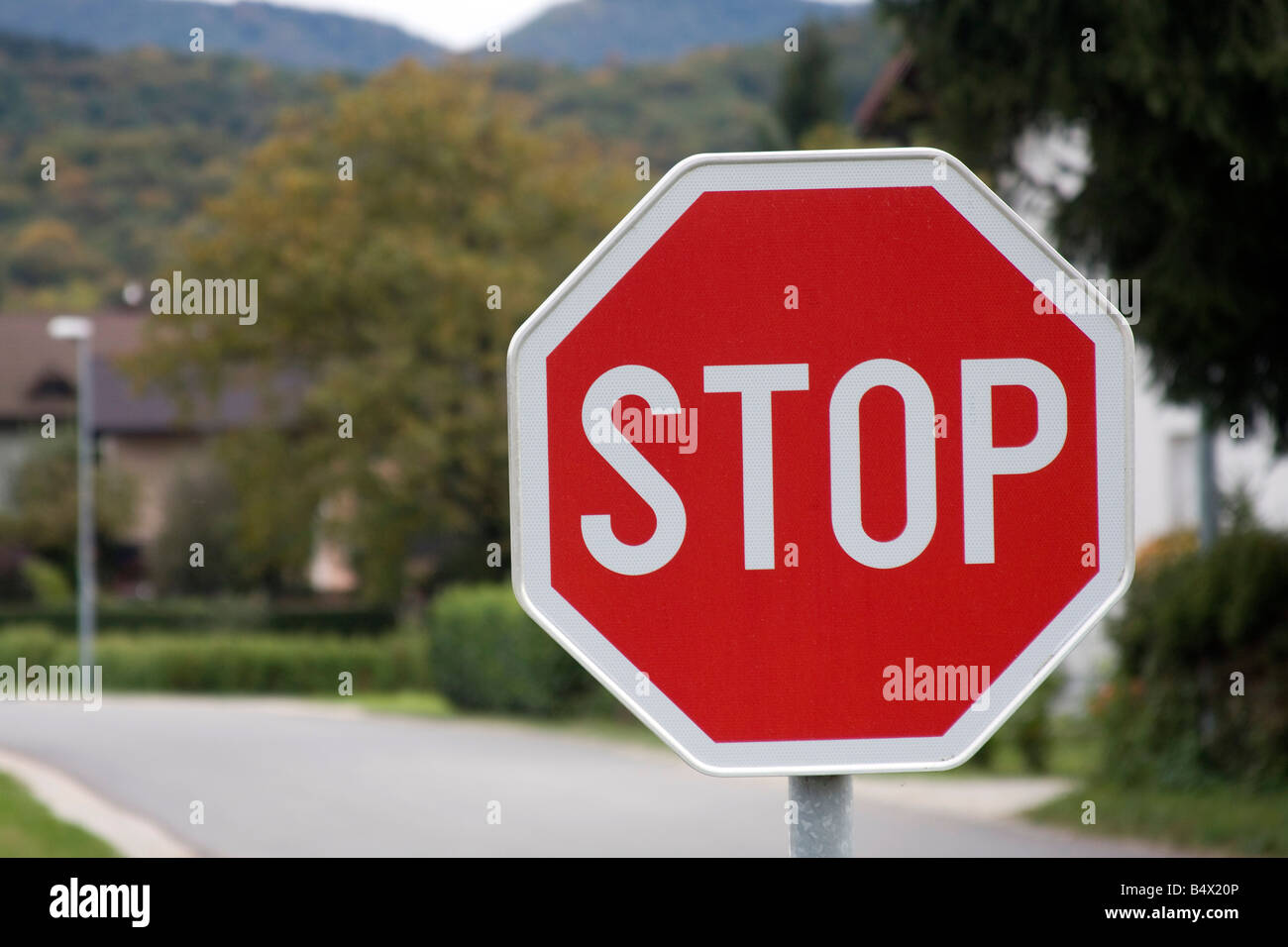 Stop sign on the road Stock Photo - Alamy