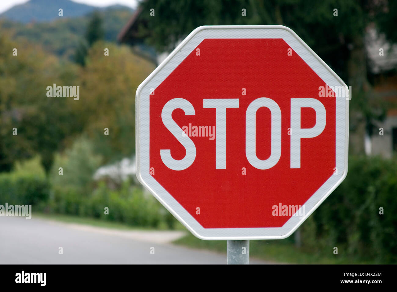 Stop sign on the road Stock Photo - Alamy