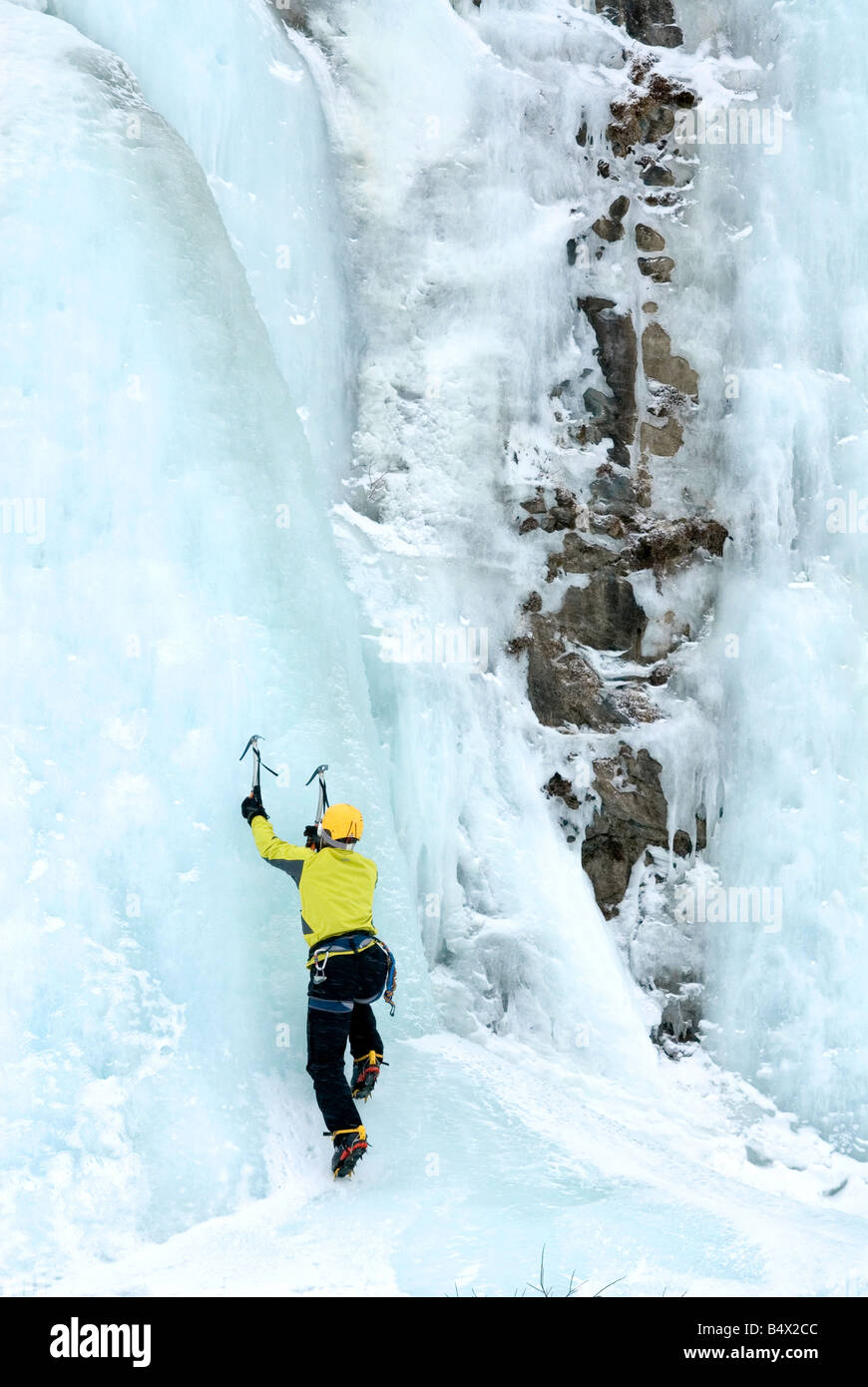 Man iceclimbing up a frozen waterfall Stock Photo - Alamy