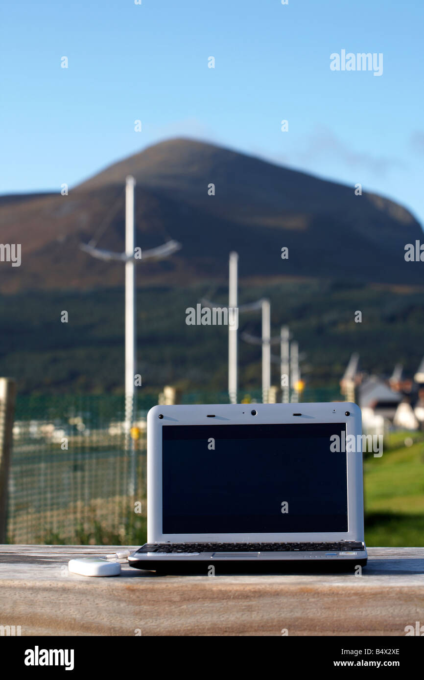notebook laptop computer connected to the internet via 3G mobile dongle ...