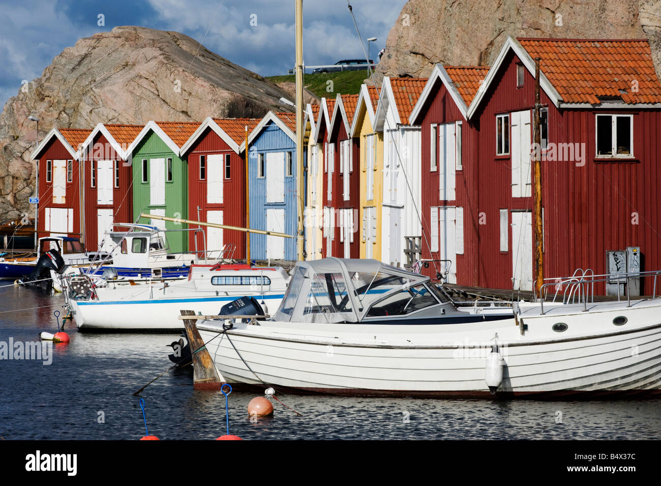 Boats and colourful boathouses at fishing village of Smogen on Bohuslan ...