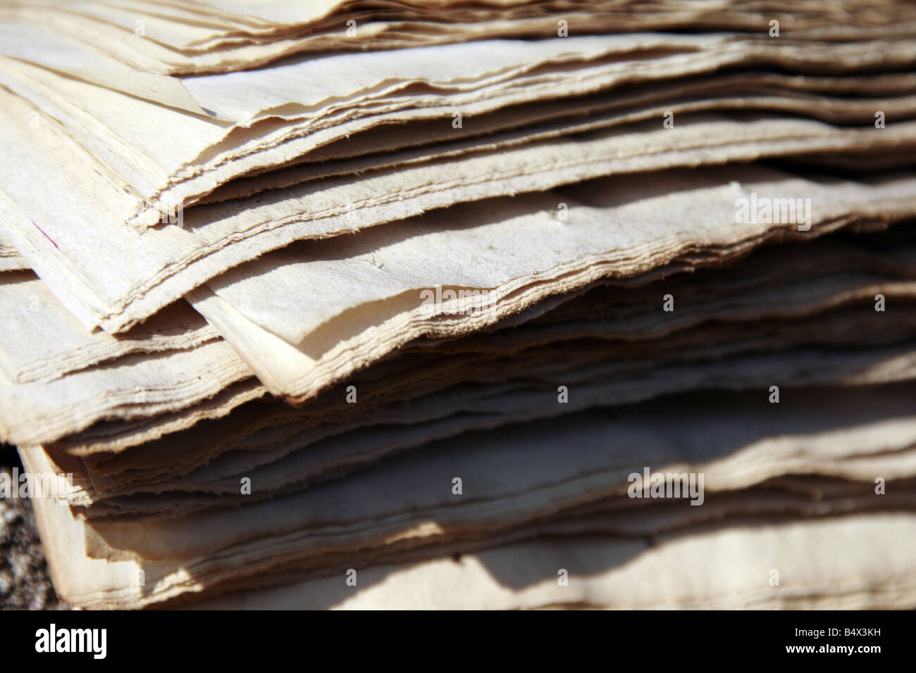 pile of old faded newspapers outdoors in sun Stock Photo - Alamy